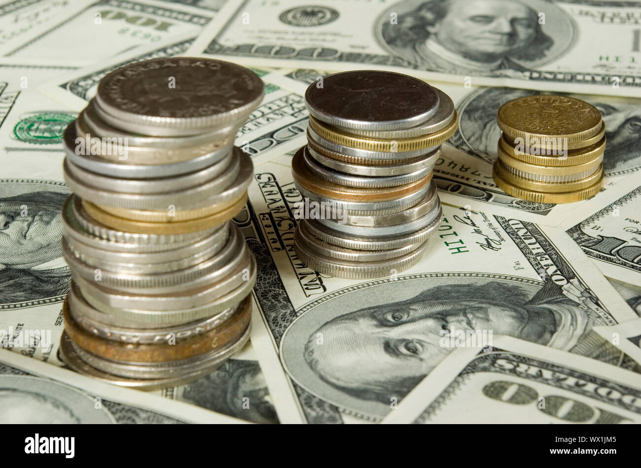 coins isolated on dollars background Stock Photo - Alamy