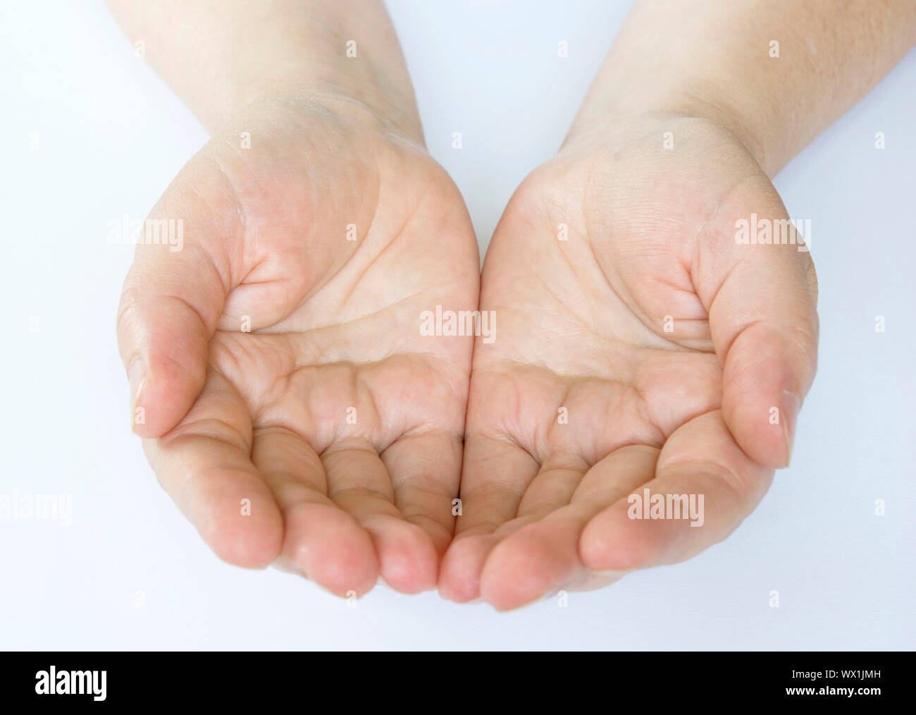 A hand begging alms on a white background Stock Photo - Alamy