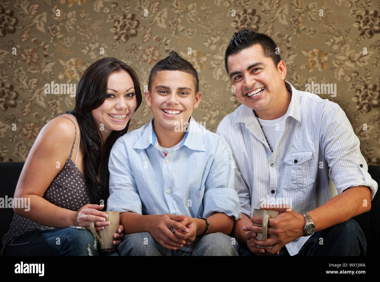 Joyful Native American family sitting together indoors Stock Photo - Alamy