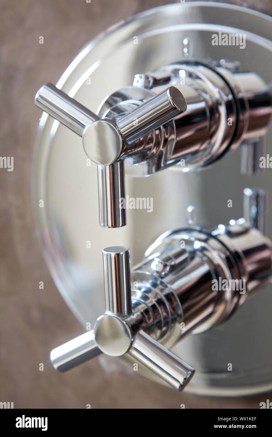 hand shower equipment on brown wall of bathroom Stock Photo - Alamy