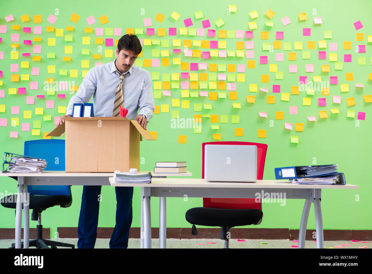 Man collecting his stuff after redundancy in the office with man Stock ...