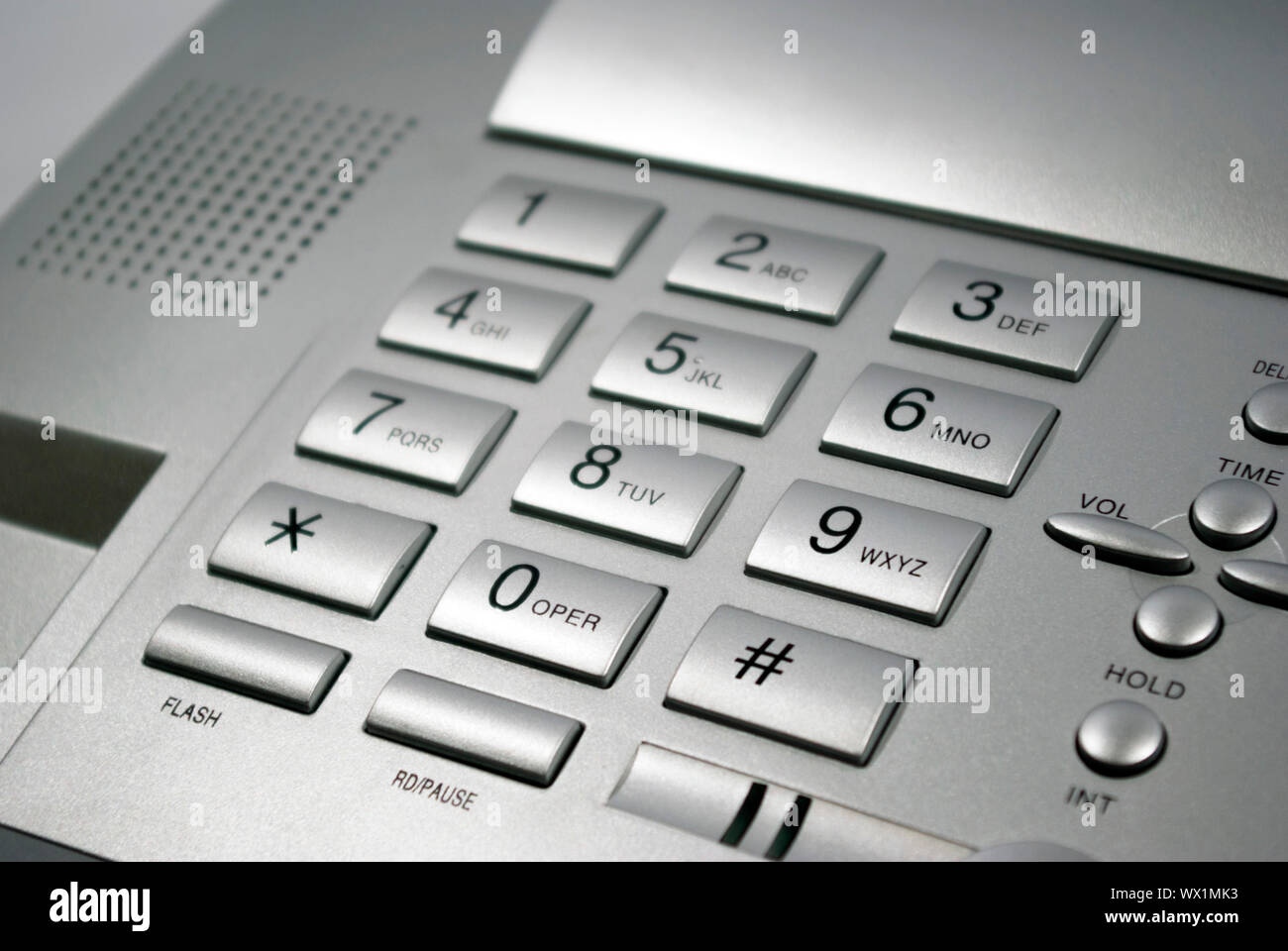 Keyboard of grey telephone by a large plan Stock Photo - Alamy