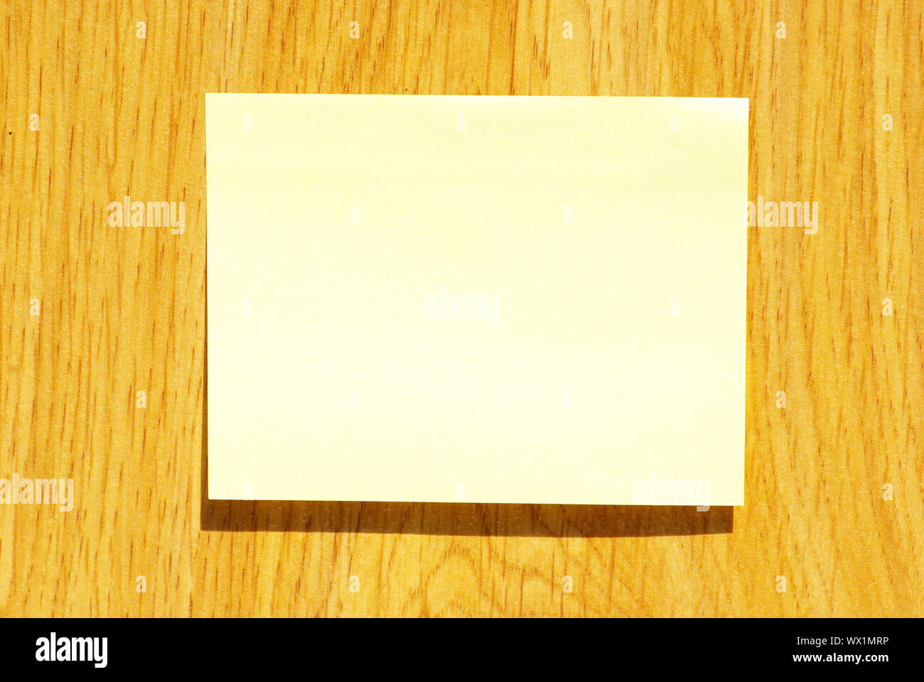 paper on wooden background. for your message Stock Photo - Alamy