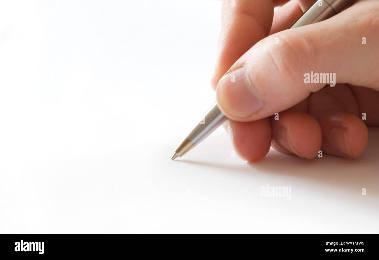 Hand holding pen isolated on white background Stock Photo - Alamy