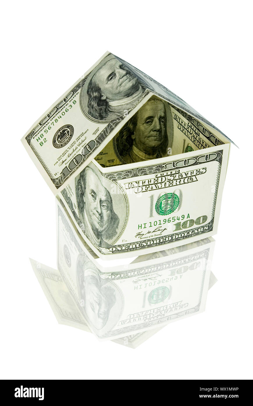 Money house on white background Stock Photo - Alamy