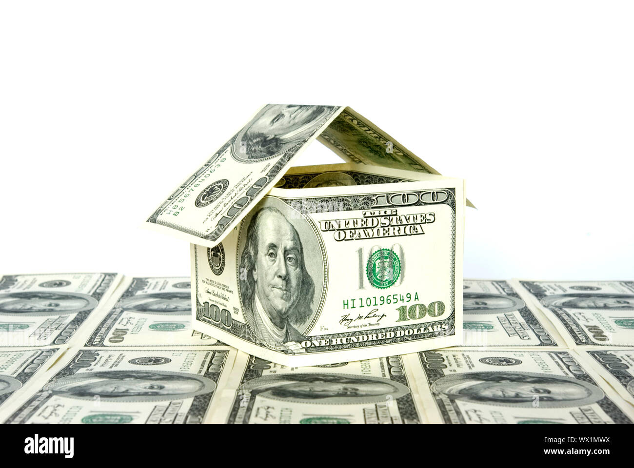 Money house on white background Stock Photo - Alamy