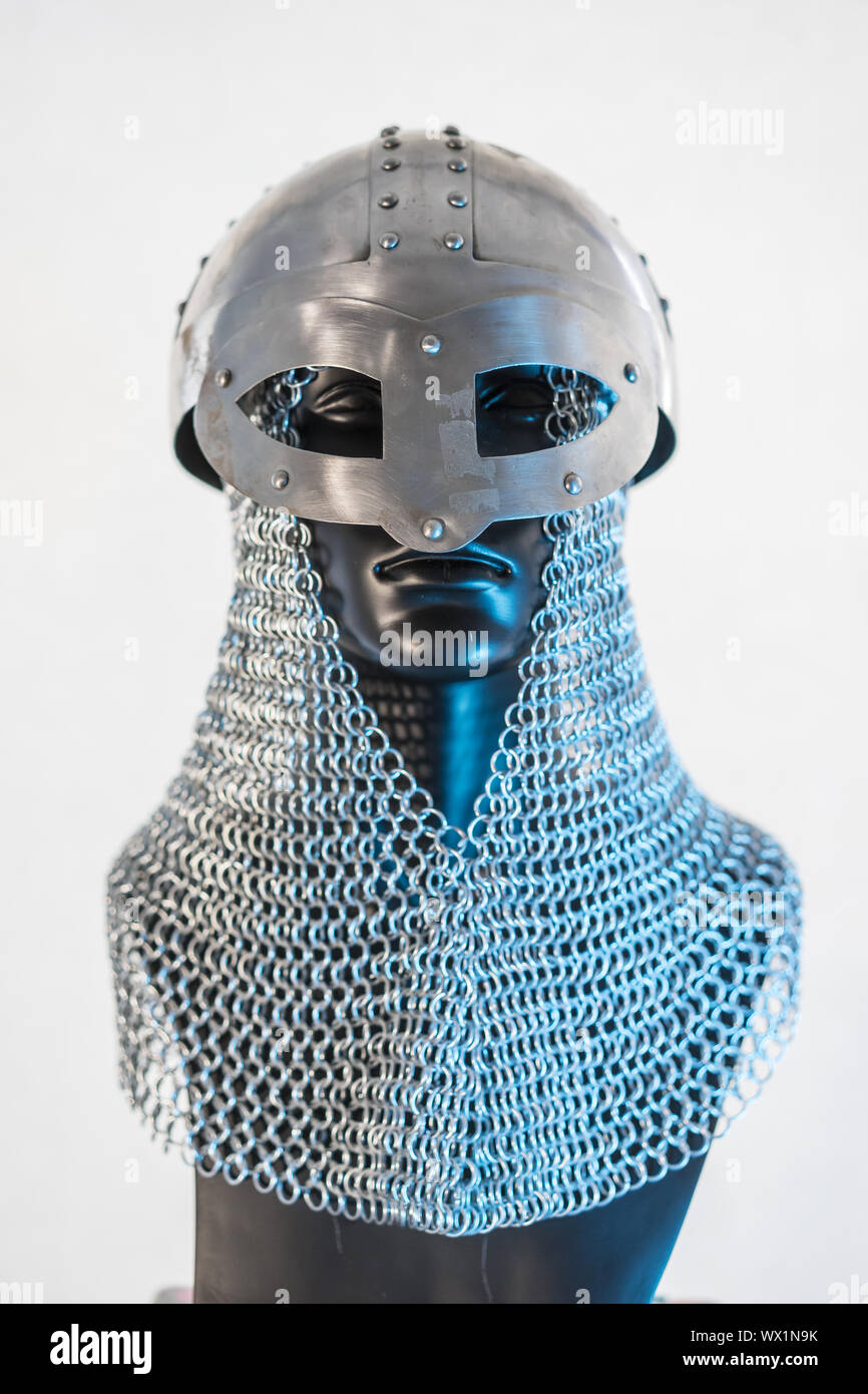 Viking helmet with chain mail in a black mannequin on white background ...