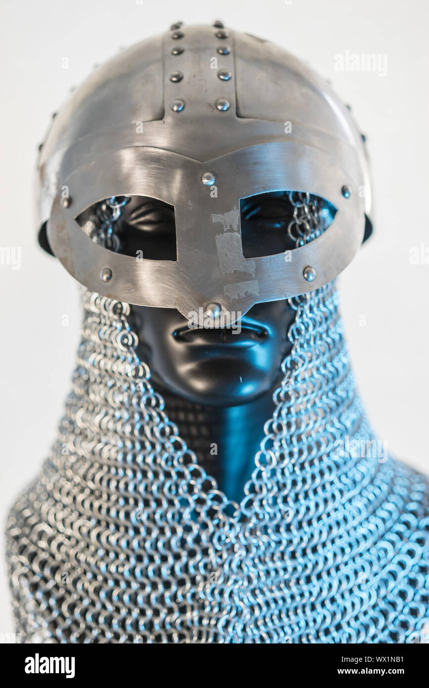 Viking helmet with chain mail in a black mannequin on white background ...