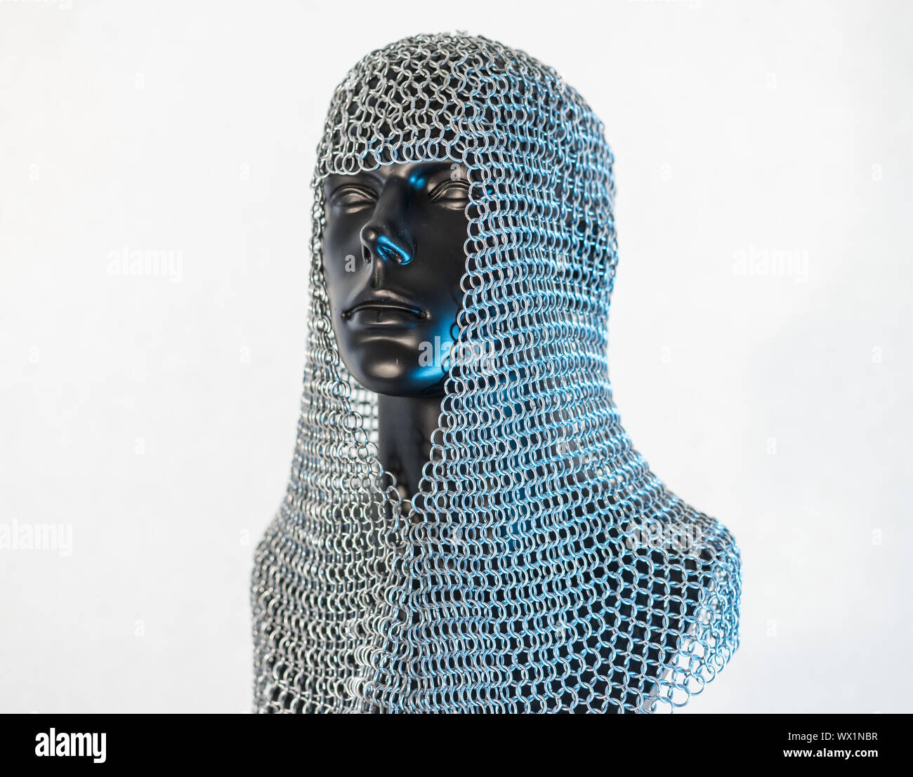 Costume, Viking helmet with chain mail in a black mannequin on white ...
