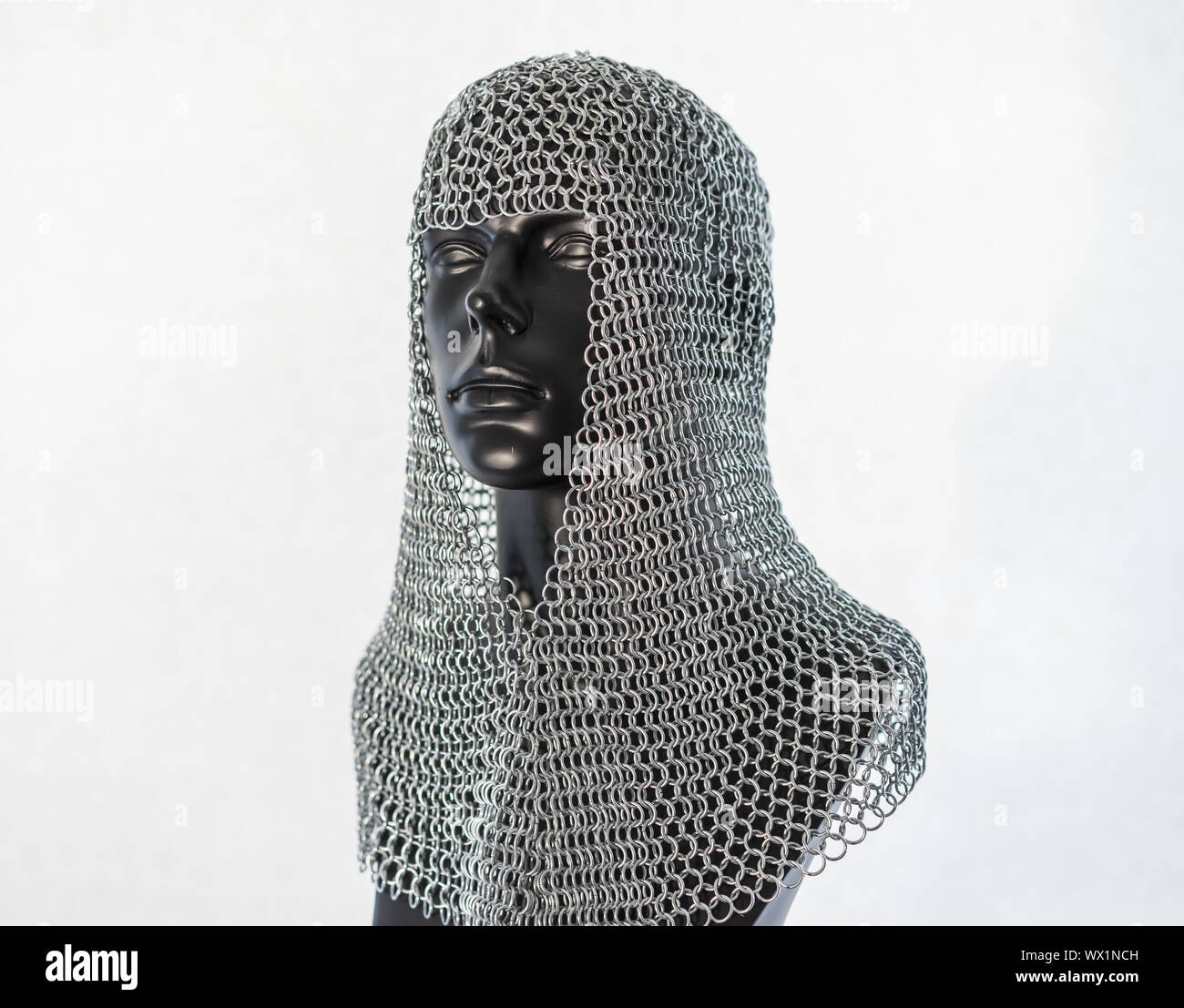 Metal, Viking helmet with chain mail in a black mannequin on white ...