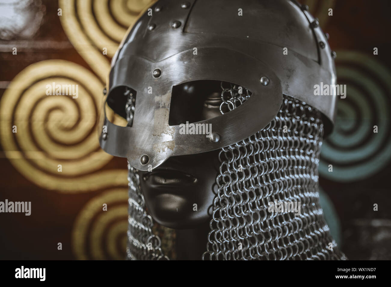 viking warrior helmet with chainmail over shield with drawings and ...