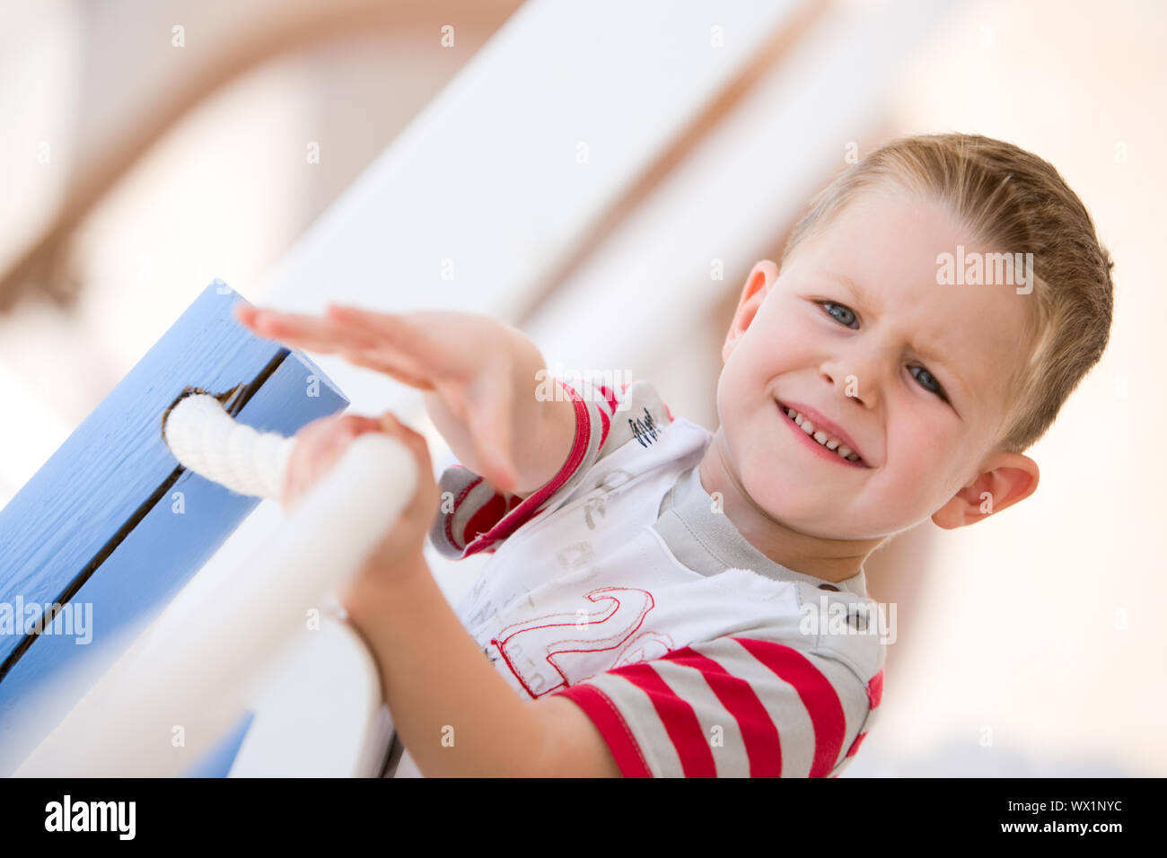 4 years old boy pulling rope Stock Photo - Alamy