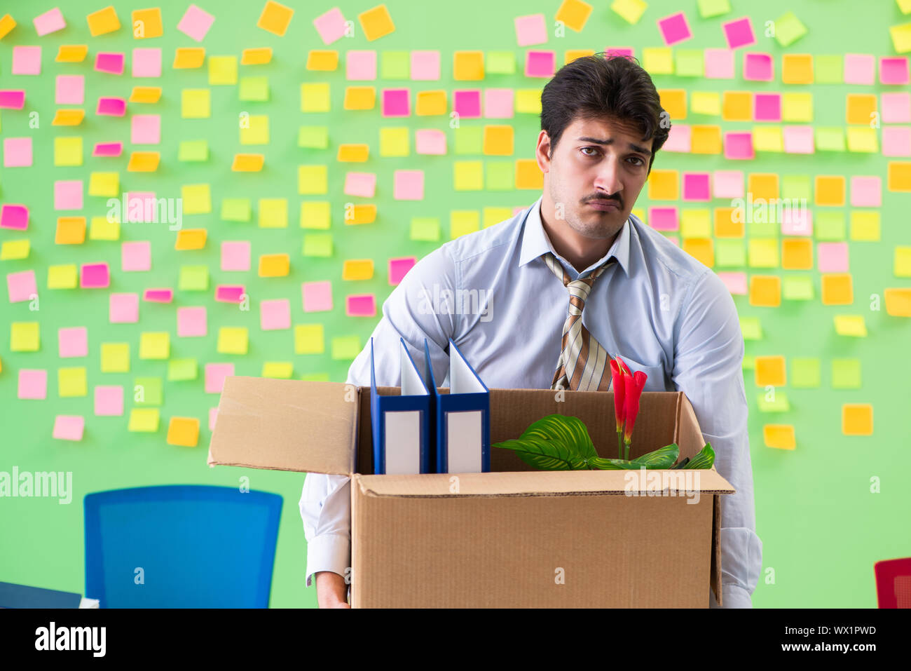 Man collecting his stuff after redundancy in the office with man Stock ...