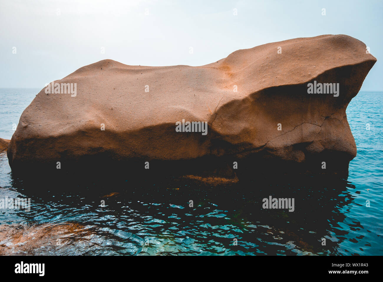 rocks in the ocean at italian coastline Stock Photo - Alamy