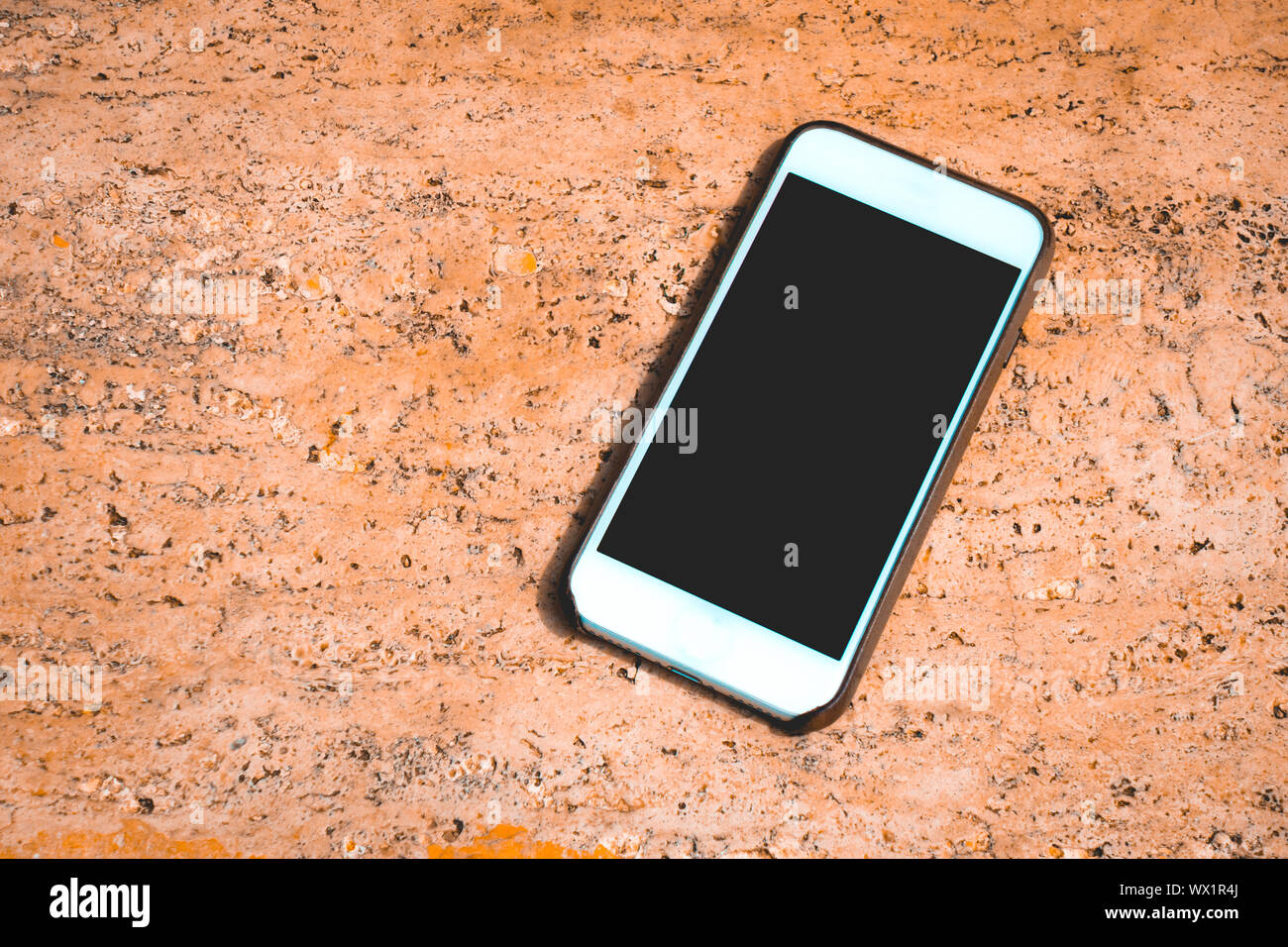 white smartphone on marble underground Stock Photo - Alamy