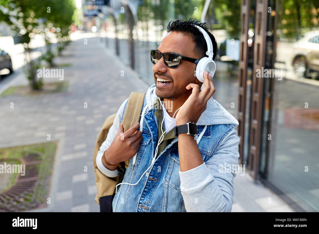 Indian man in headphones hi-res stock photography and images - Alamy
