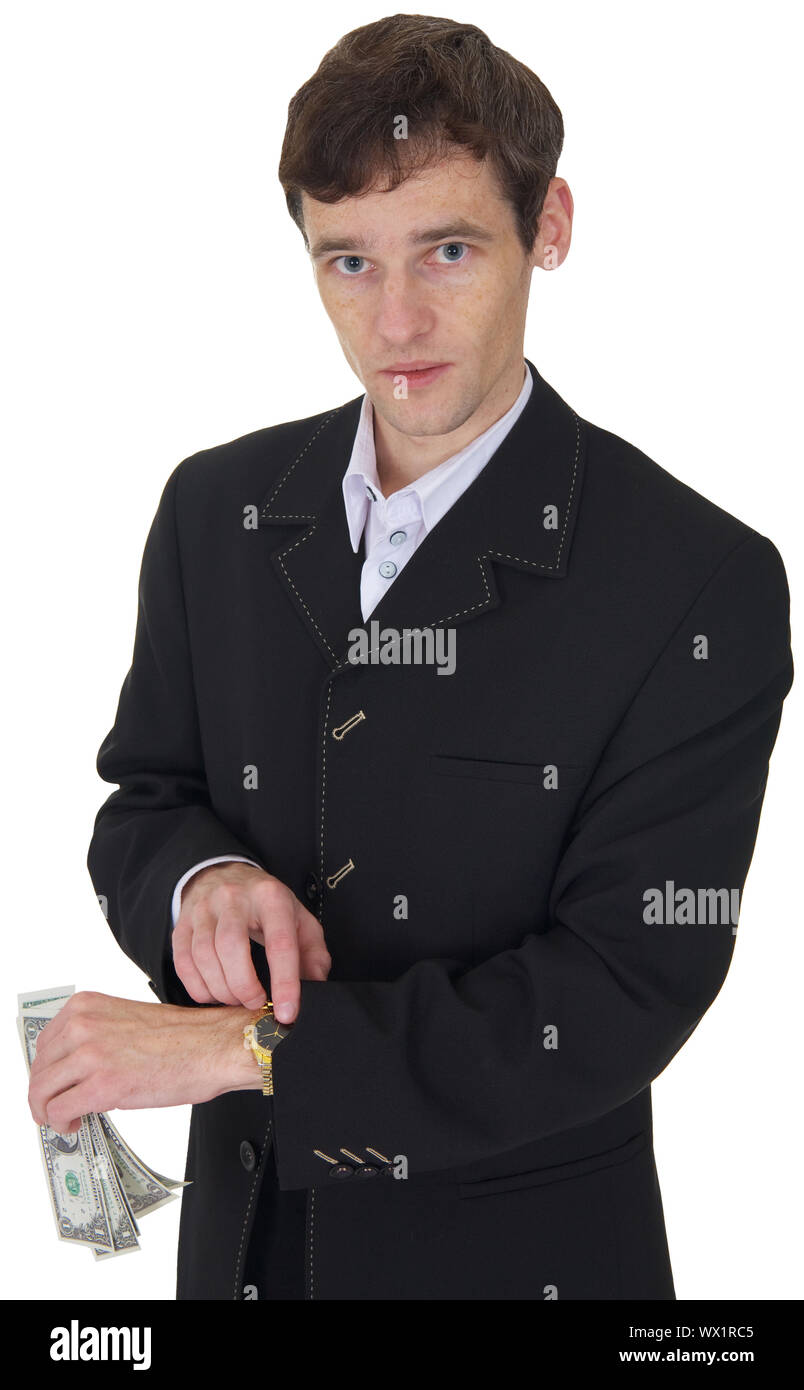 The man in a business suit with a pack of dollars in a hand shows on ...