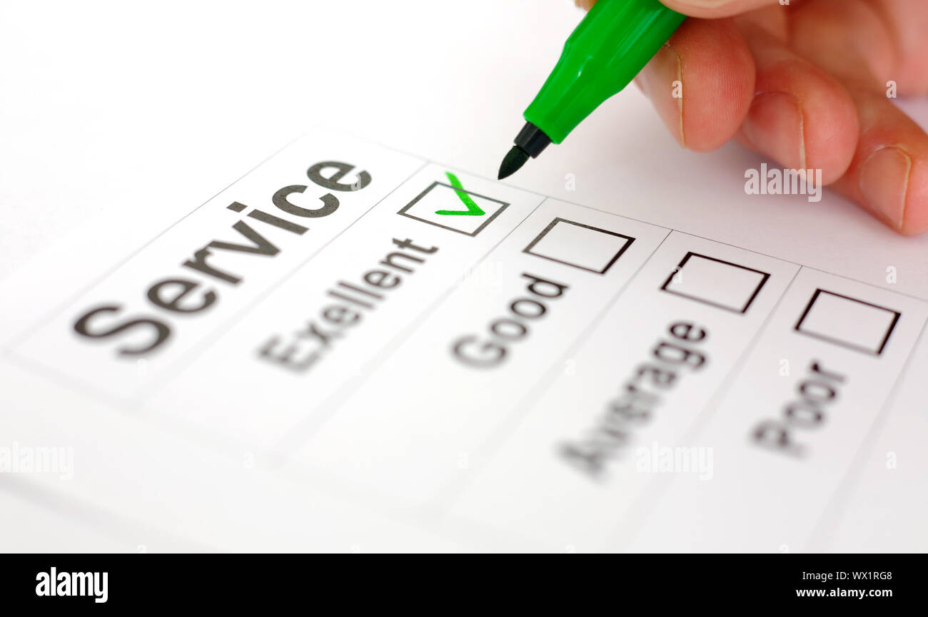 Hand with a marker in a hand filling the questionnaire Stock Photo - Alamy