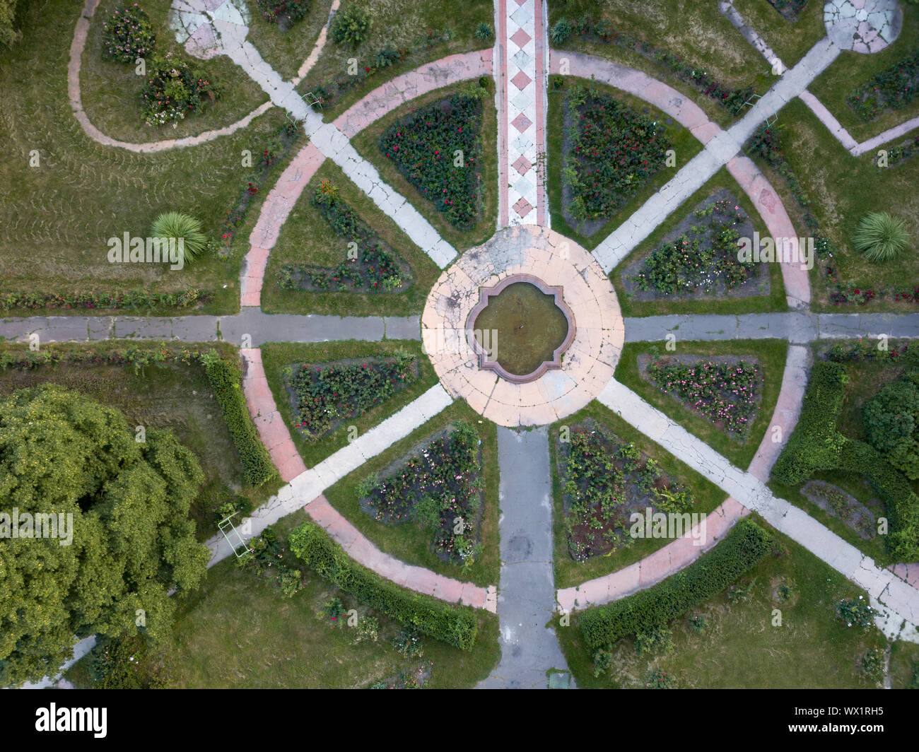 Symmetrical round shape in the garden. The aerial view from the drone ...