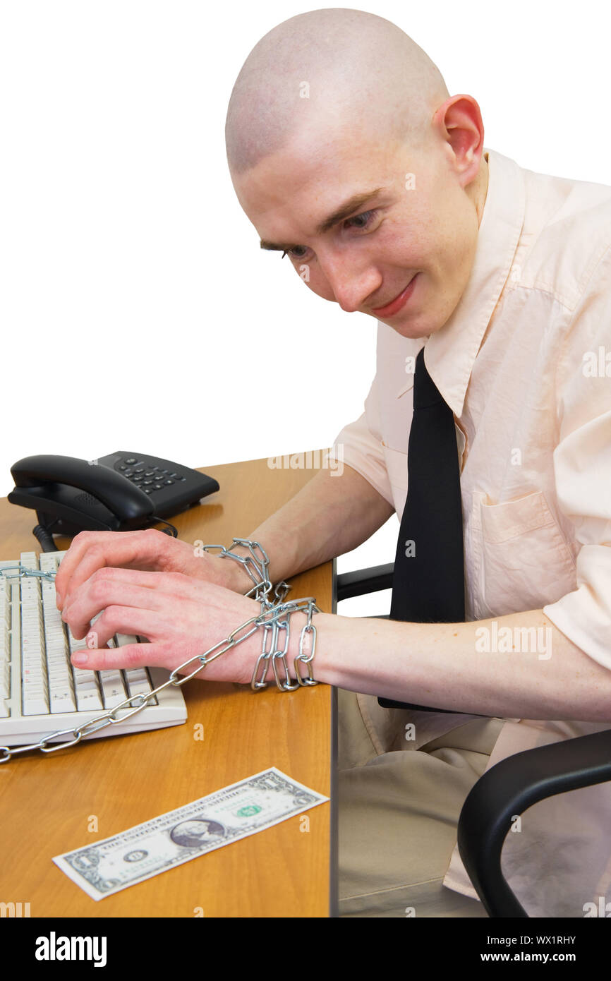 Man riveted by chain to keyboard with longing looks at dollar Stock ...