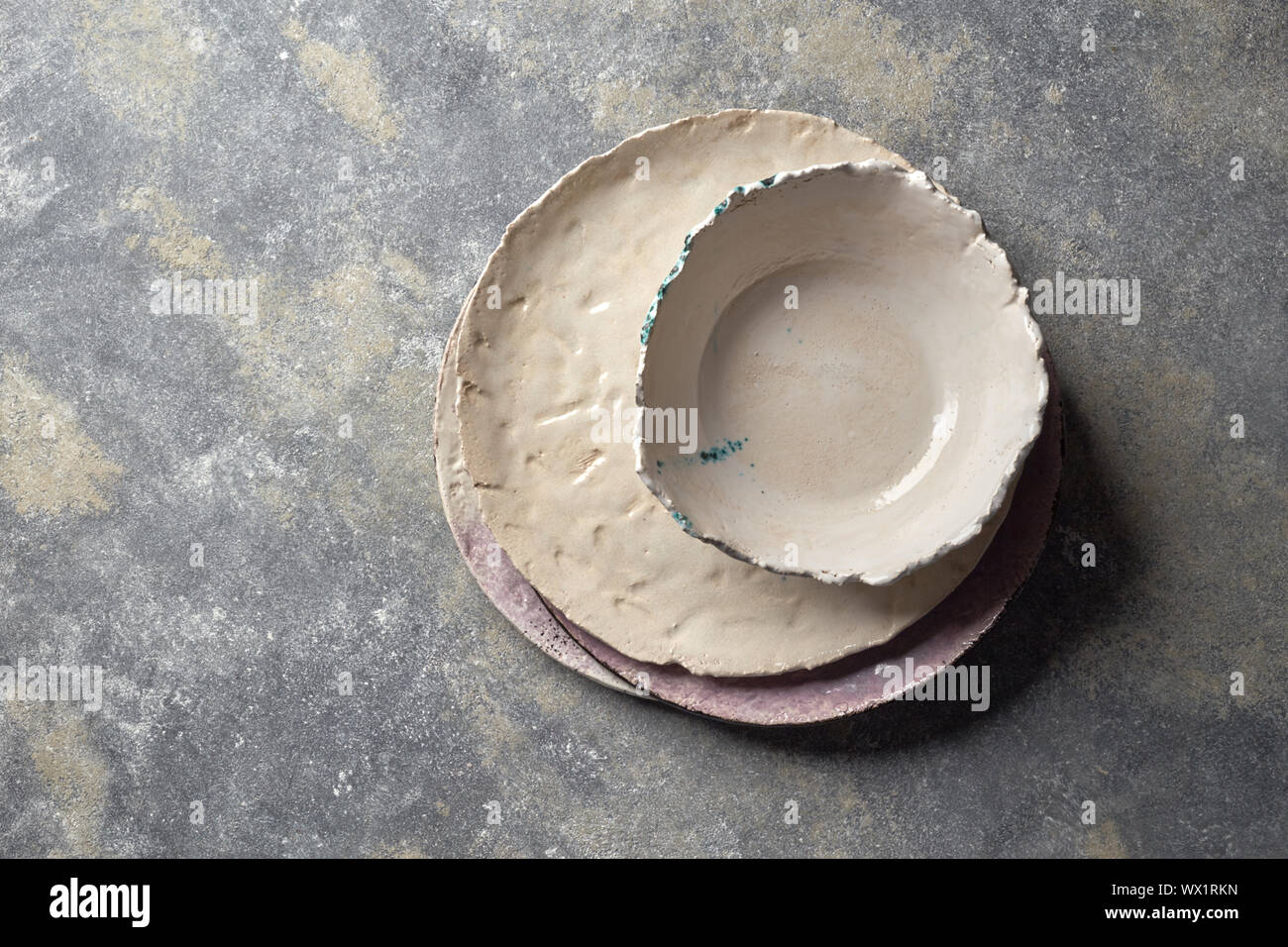 Traditional decorative handcrafted clay dishes, covered with glazed on ...