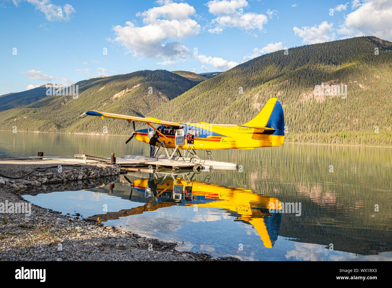Pilot gets float plane ready at Muncho Lake, British Columbia Stock ...