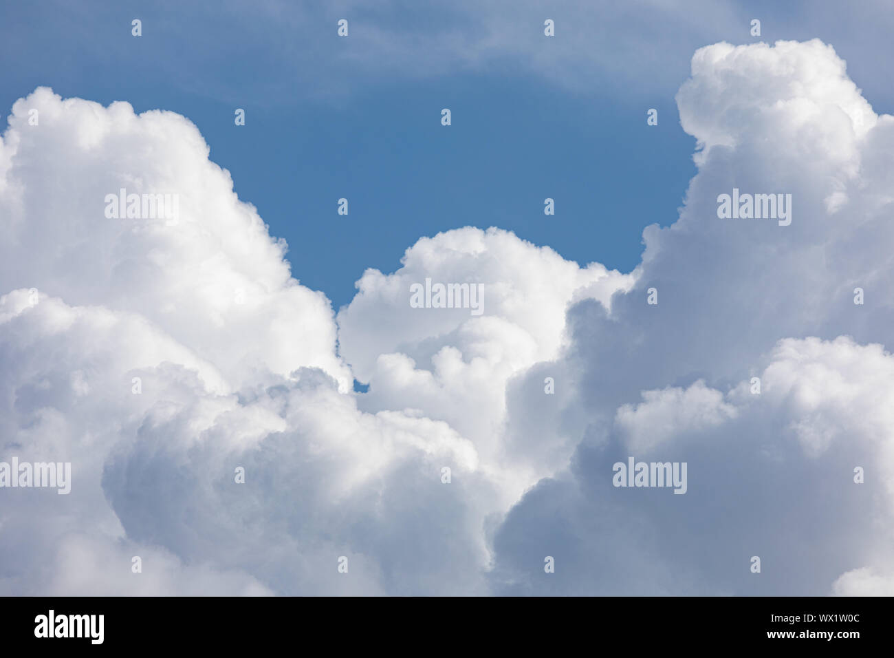 Fluffy cloud edge and blue sky cloudscape background Stock Photo - Alamy