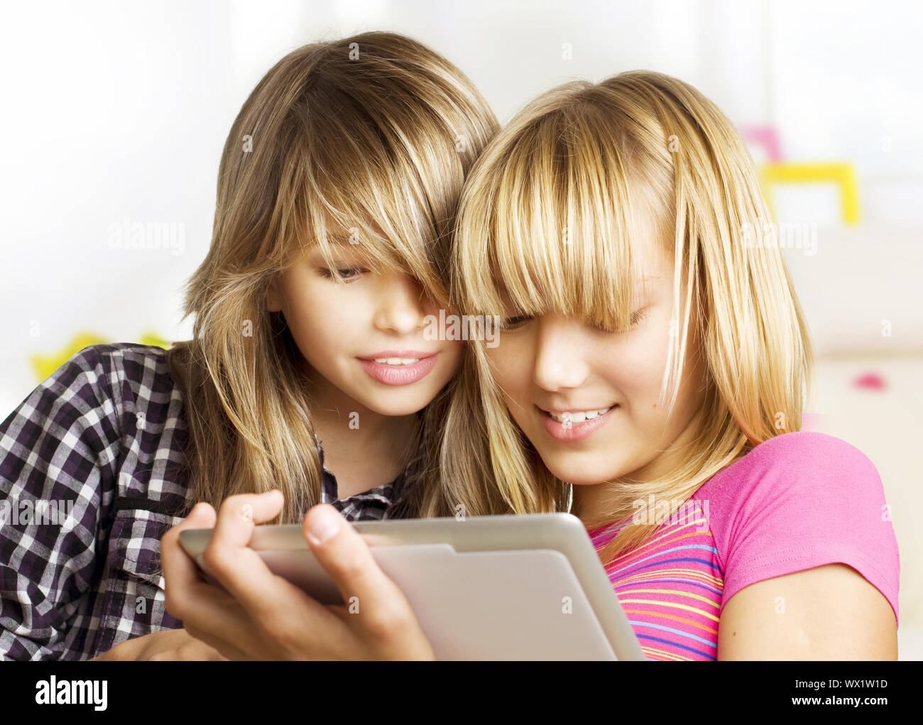 Teenage girls using touchpad. PC tablet Stock Photo - Alamy