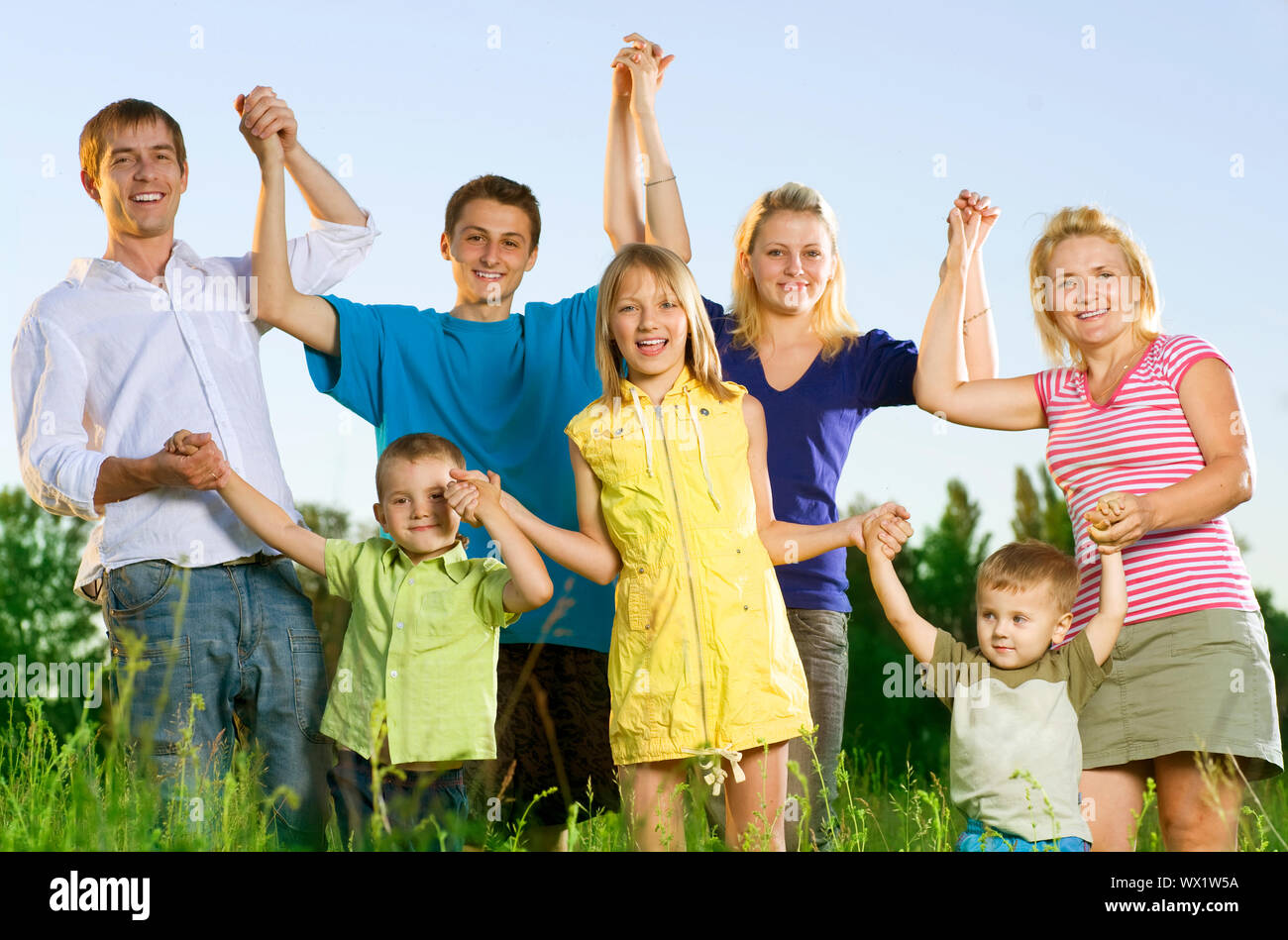 Happy Friends Outdoors. Hands Up Stock Photo - Alamy