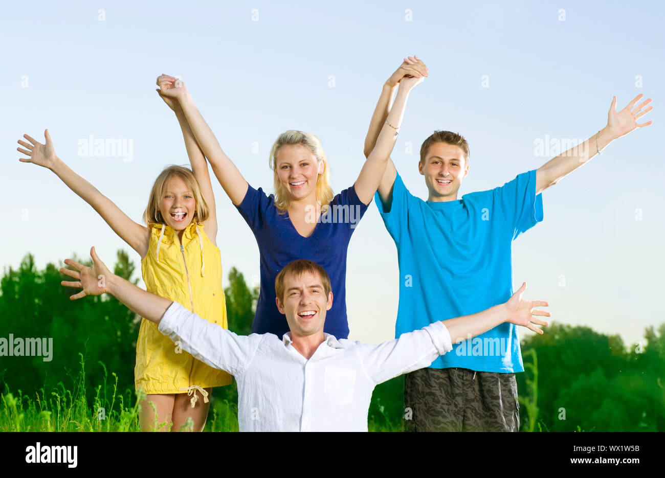 Happy Friends Outdoors. Hands Up Stock Photo - Alamy