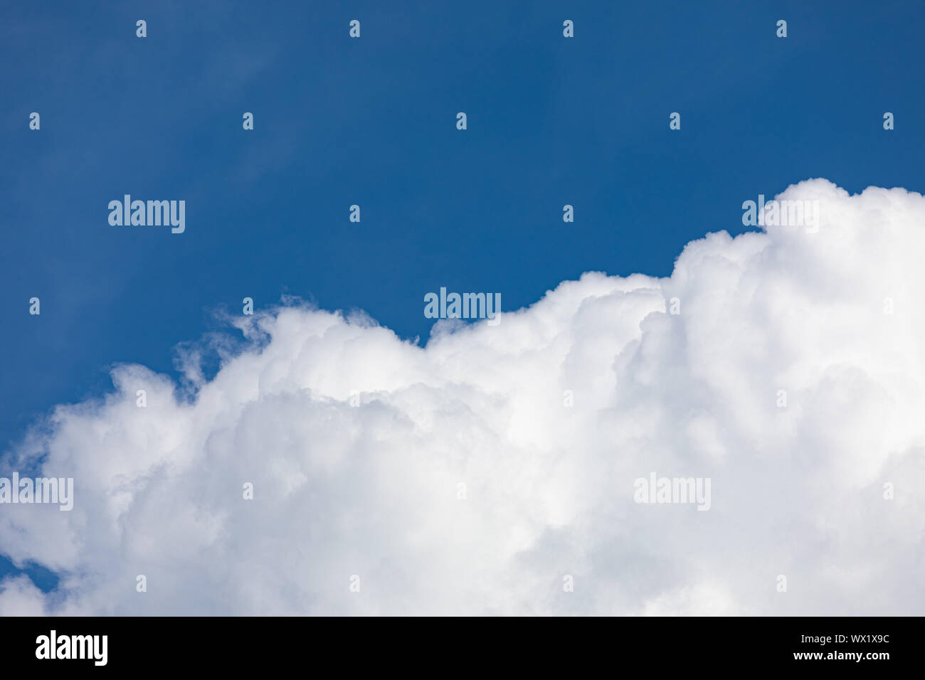 Fluffy cloud edge and blue sky cloudscape background Stock Photo - Alamy