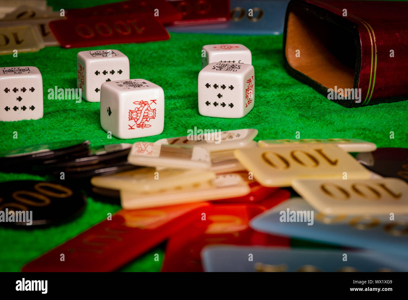 The dice game on the green table Stock Photo - Alamy