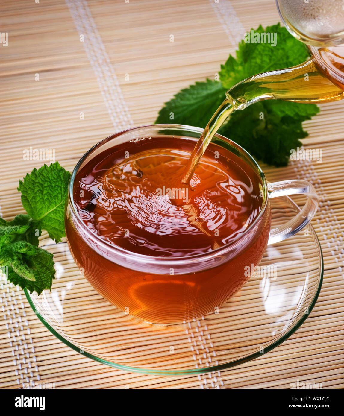 Pouring Healthy Tea With Mint Stock Photo - Alamy