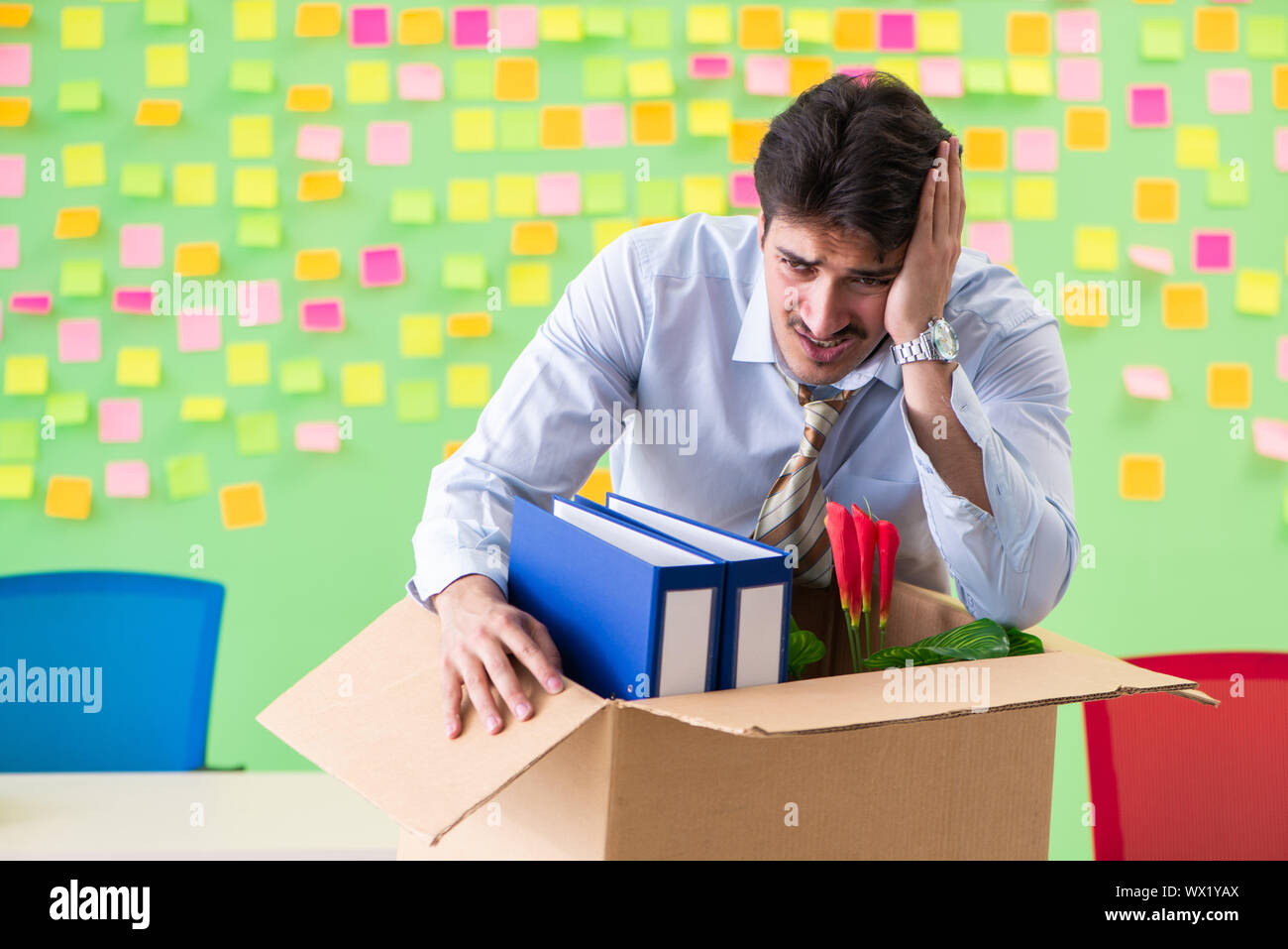 Man collecting his stuff after redundancy in the office with man Stock ...