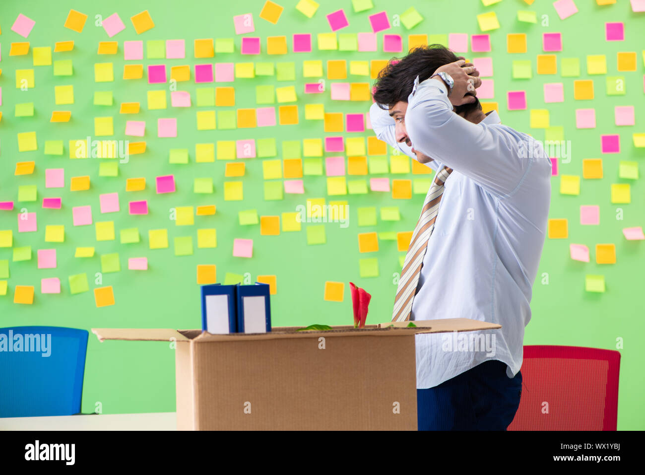 Man collecting his stuff after redundancy in the office with man Stock ...