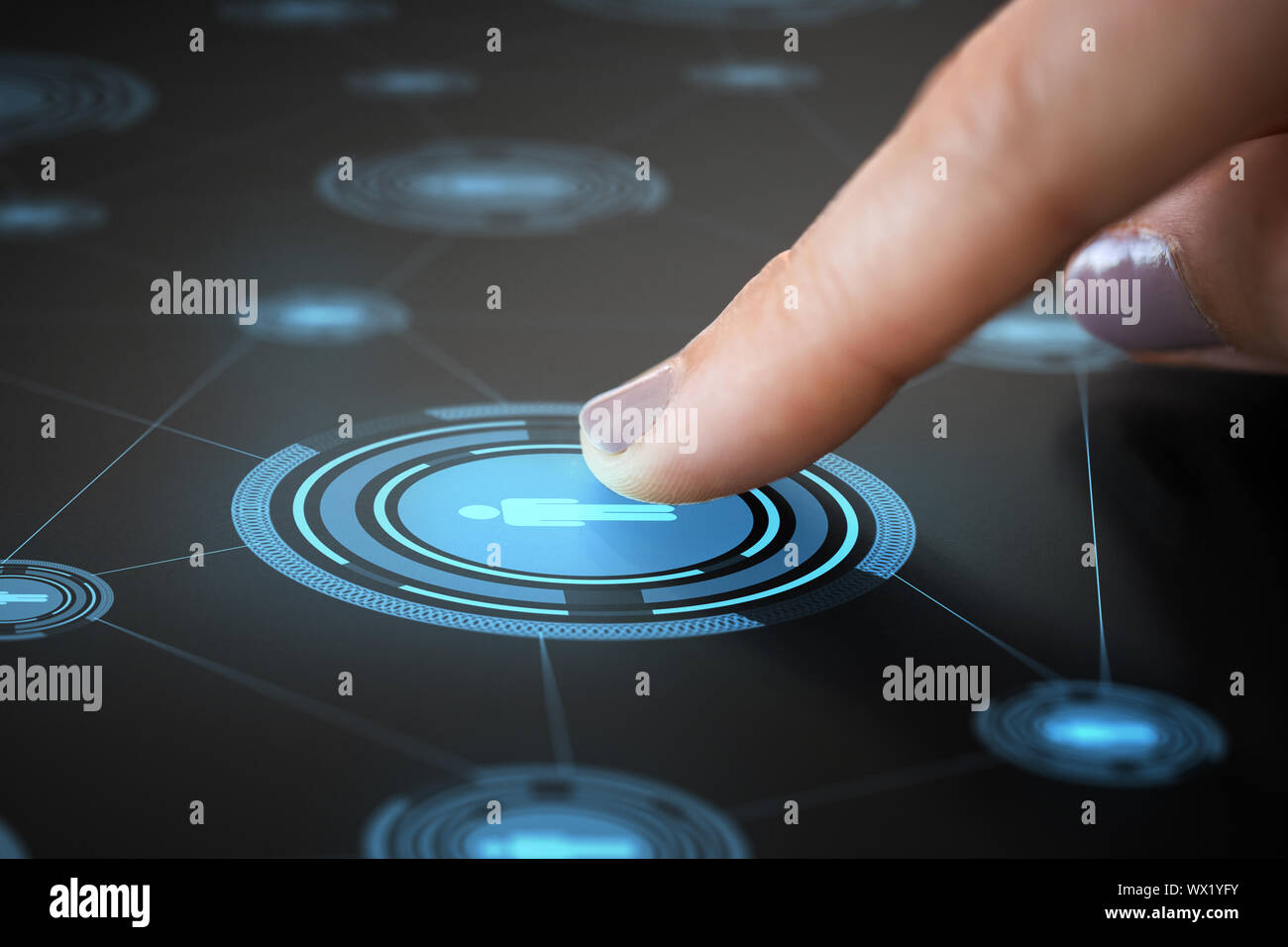 finger touching network icon on interactive panel Stock Photo - Alamy