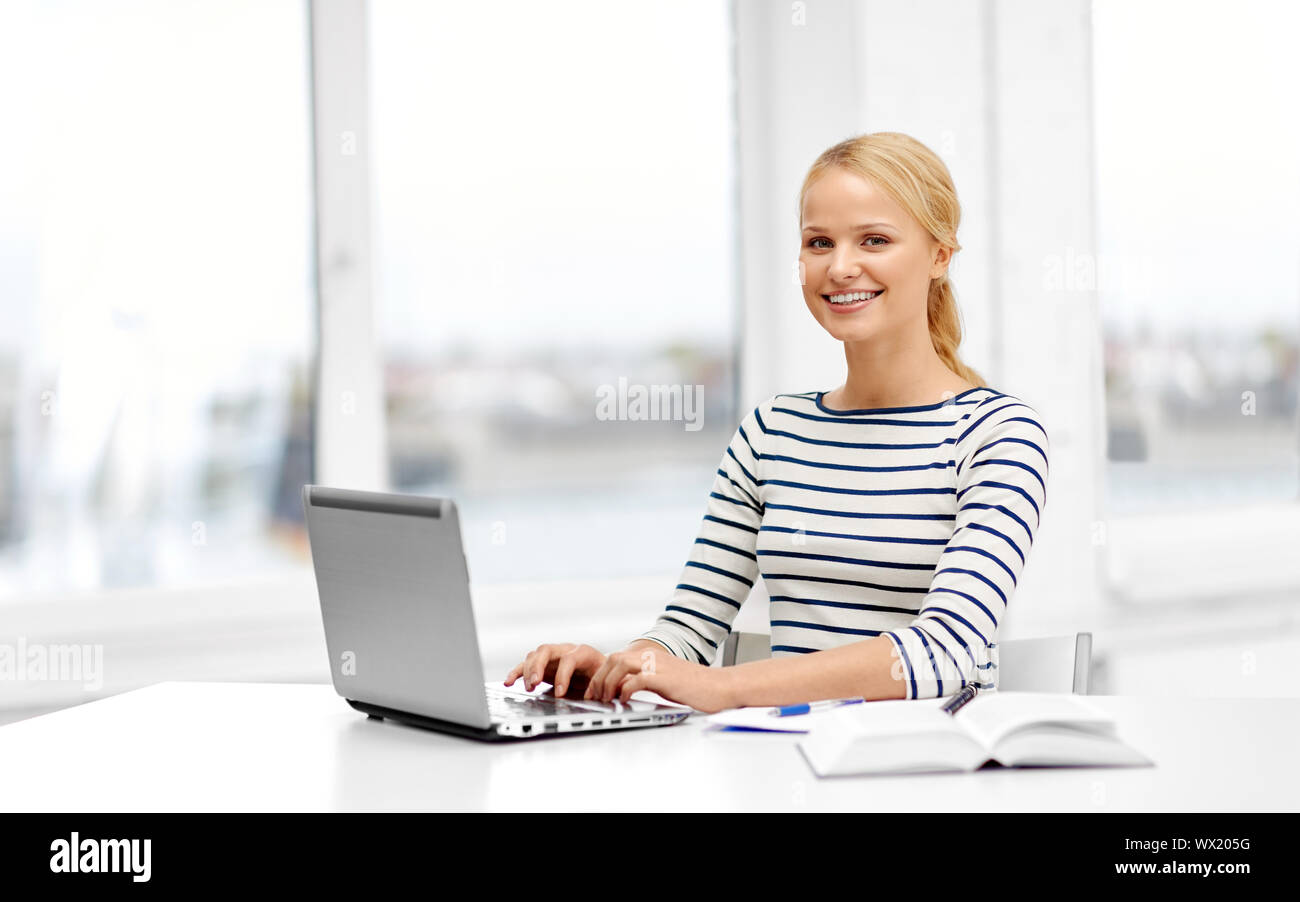 student woman with laptop and book Stock Photo - Alamy