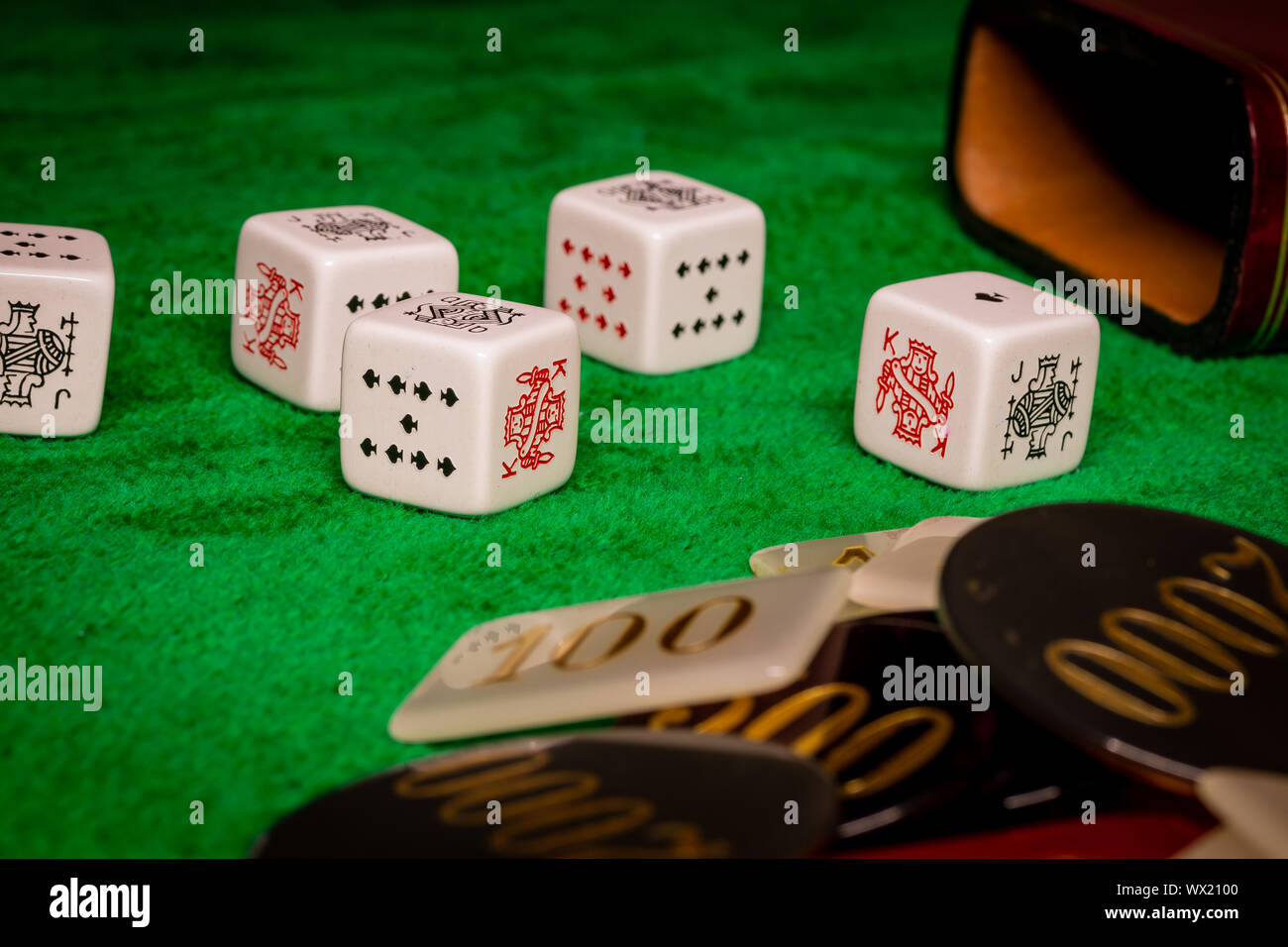 The dice game on the green table Stock Photo - Alamy