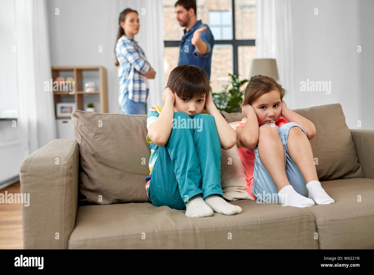 sad children and parents quarreling at home Stock Photo - Alamy
