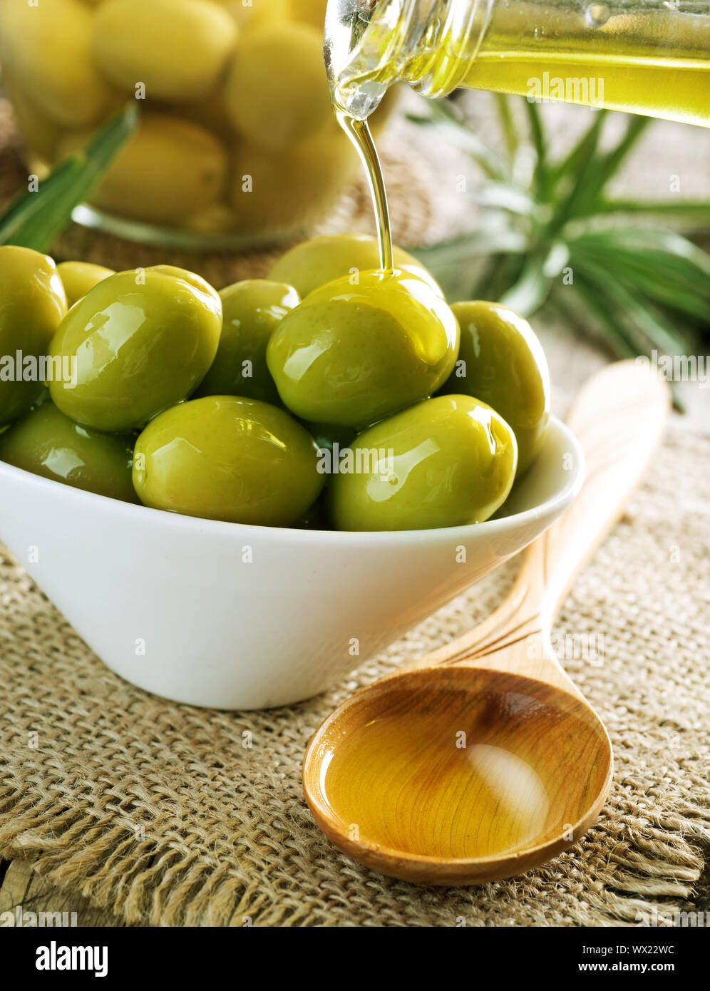 Olives And Pouring Olive Oil Stock Photo - Alamy