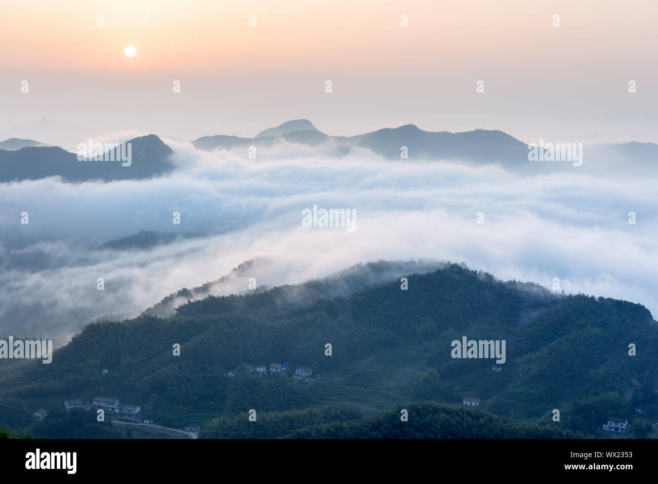 Clouds above mountain in valley hi-res stock photography and images - Alamy