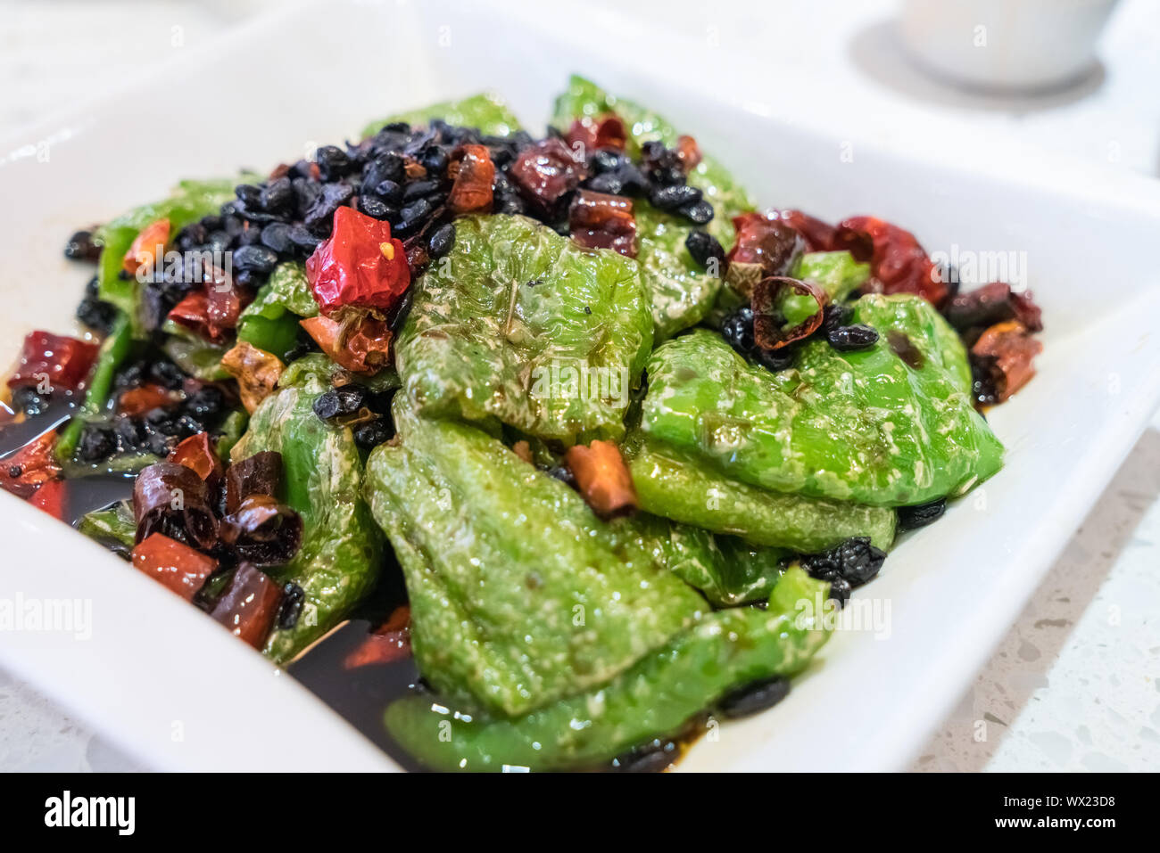 tiger skins green peppers Stock Photo - Alamy