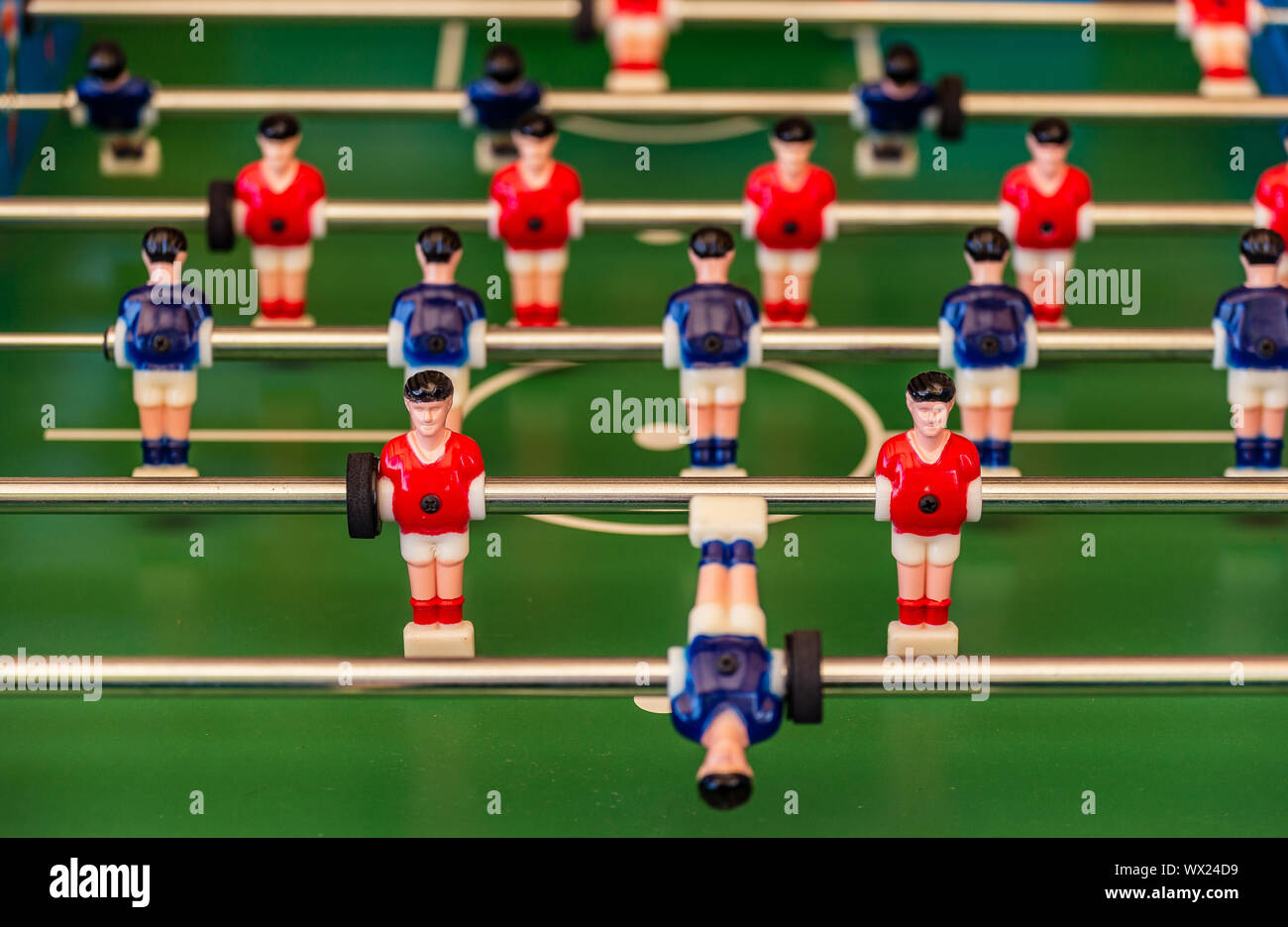 Blue vs. Red team in a table football match Stock Photo - Alamy