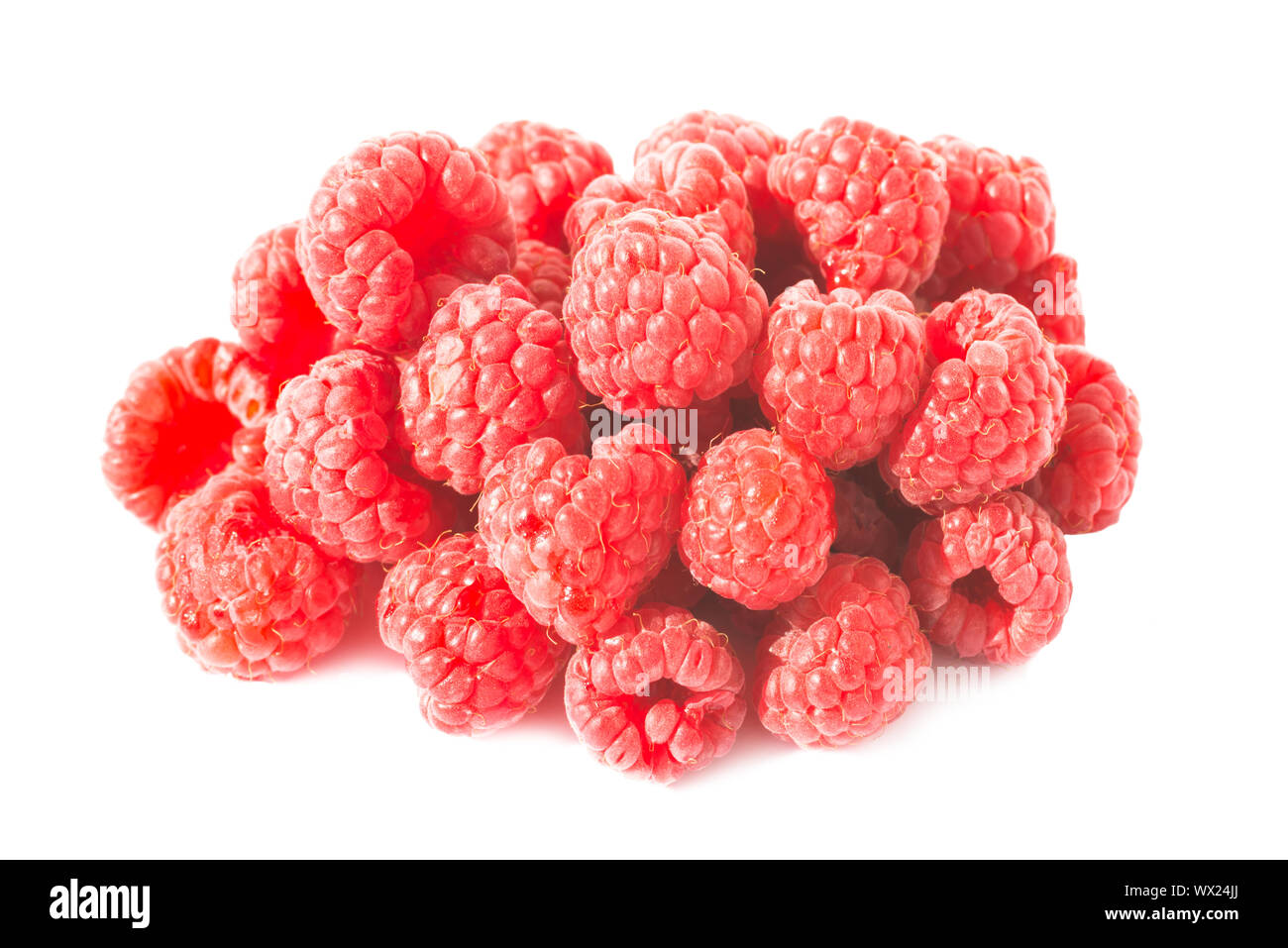 Pile of raspberries isolated on white Stock Photo - Alamy