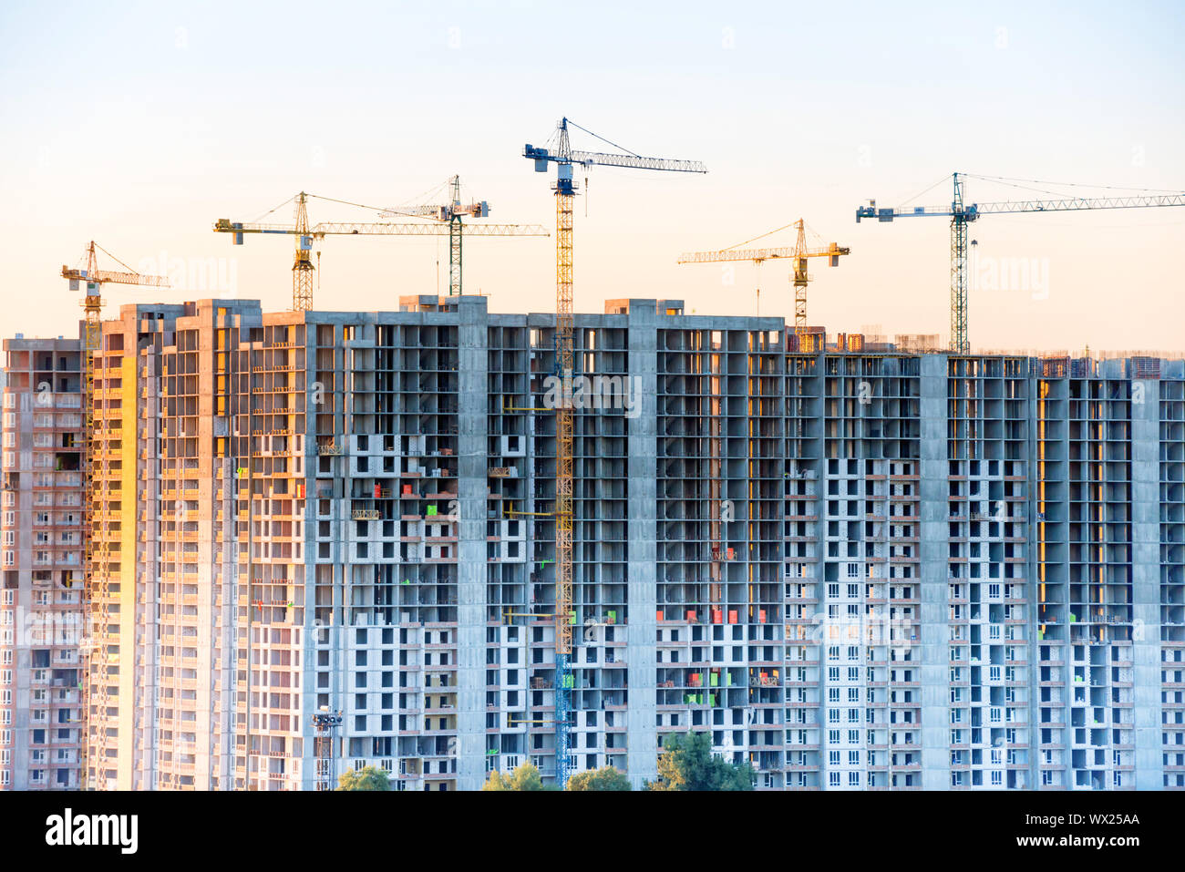 Construction site with buildind cranes Stock Photo - Alamy