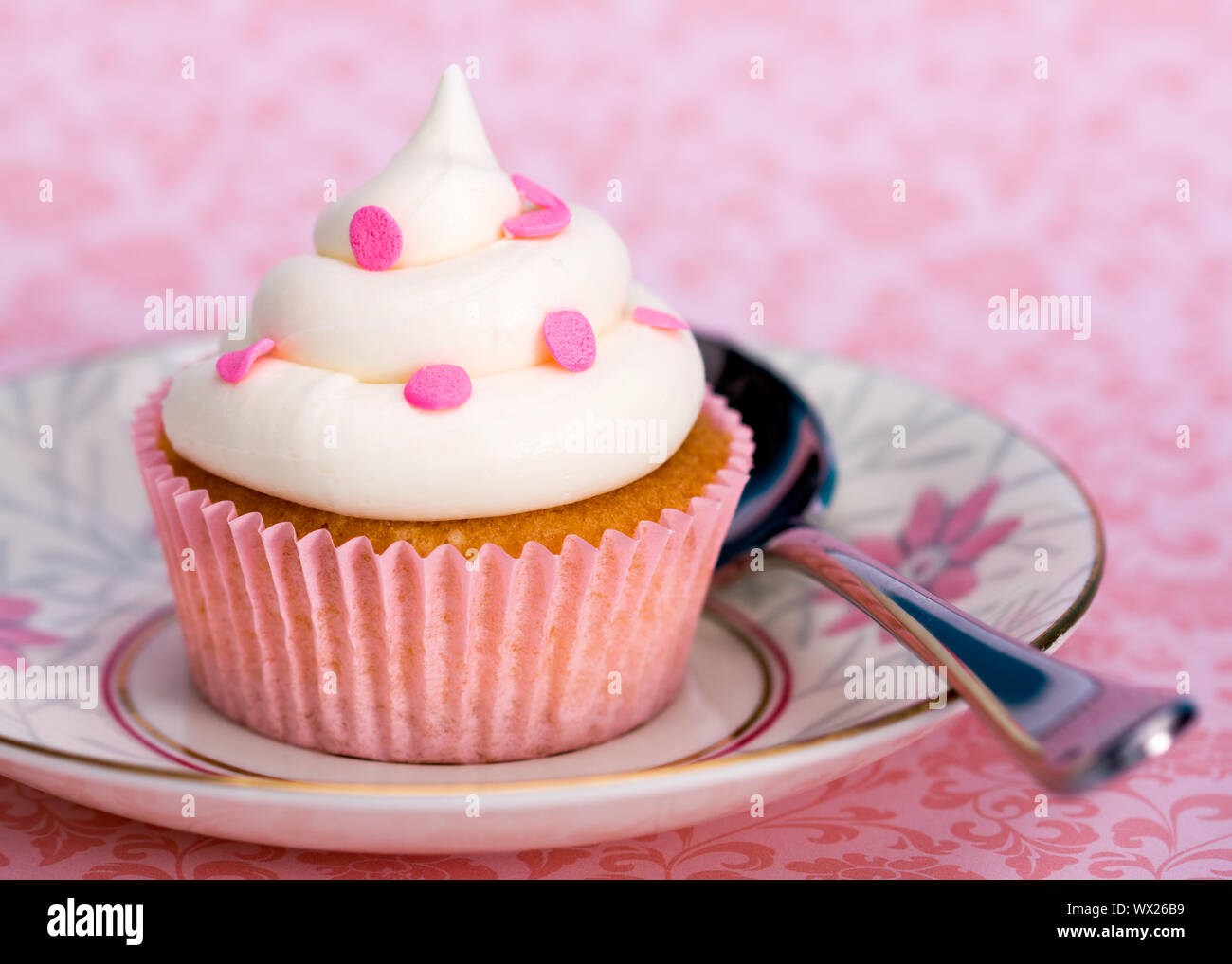 Pink cupcake, ready to eat Stock Photo - Alamy