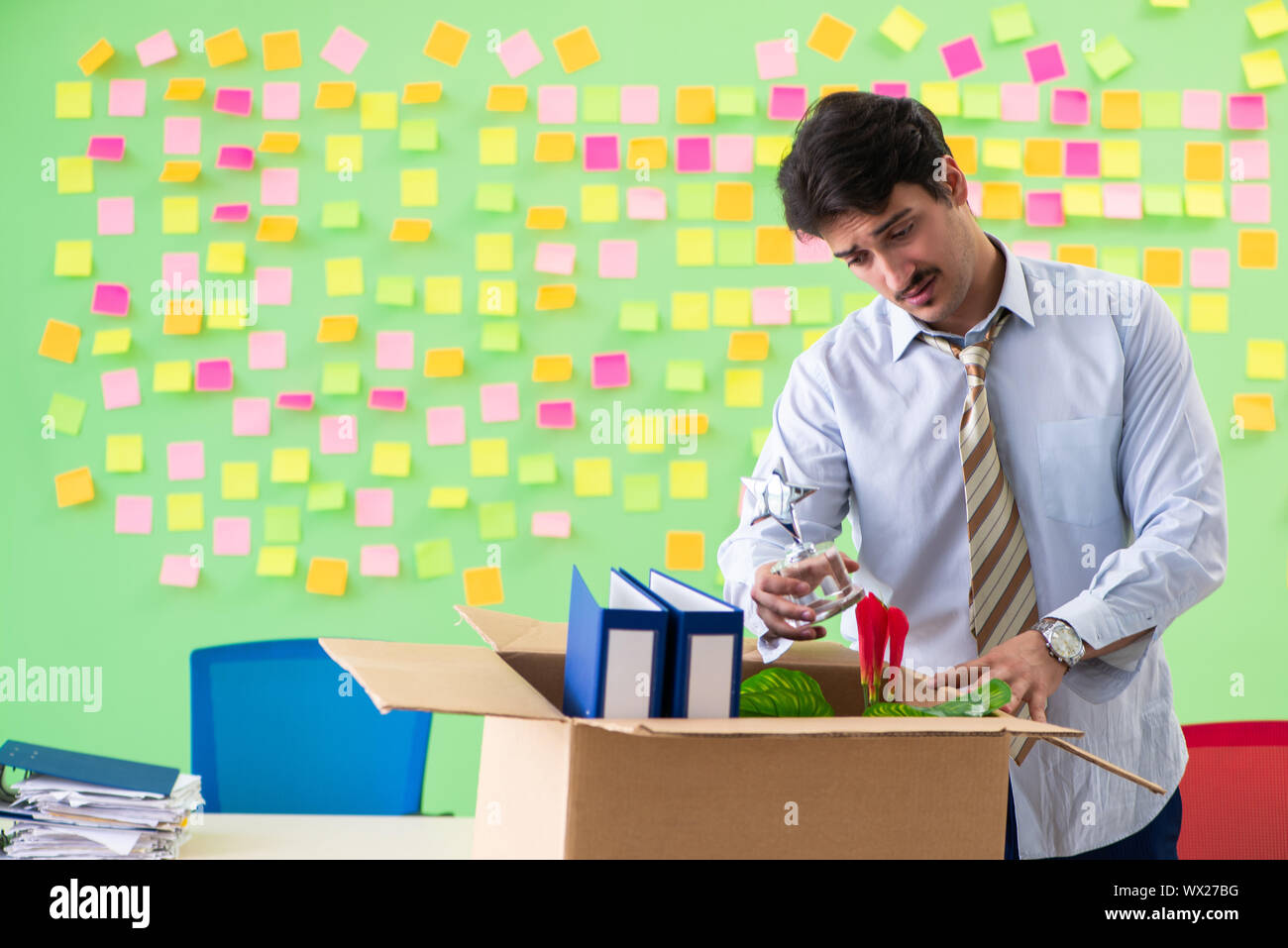 Man collecting his stuff after redundancy in the office with man Stock ...