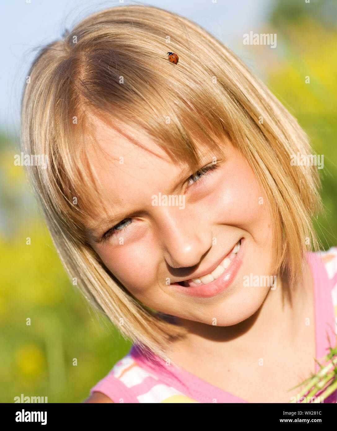 Summer Girl With Ladybird On Her Hair Stock Photo - Alamy