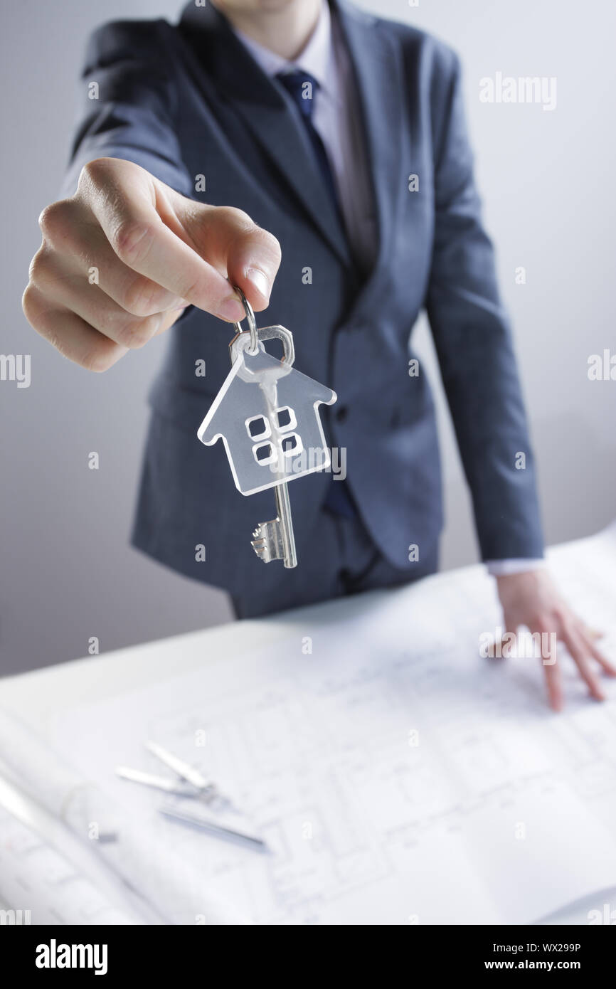 Mans hand giving house hi-res stock photography and images - Alamy