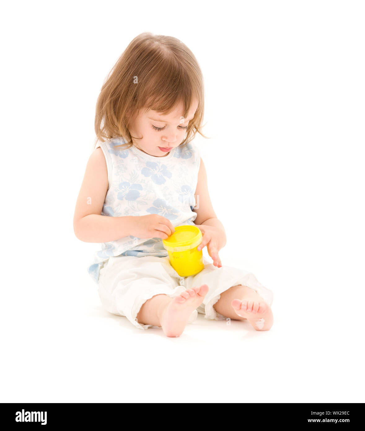 picture of little girl with yellow modelling foam over white Stock ...